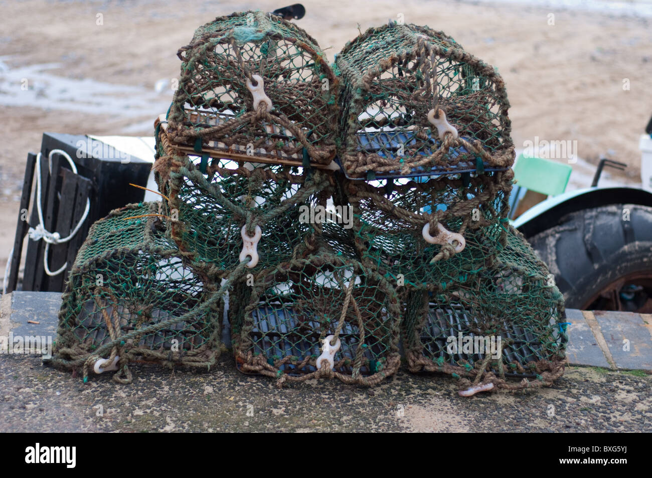 Creel Shaped Lobster pots arranged at the quay side awaiting the next ...