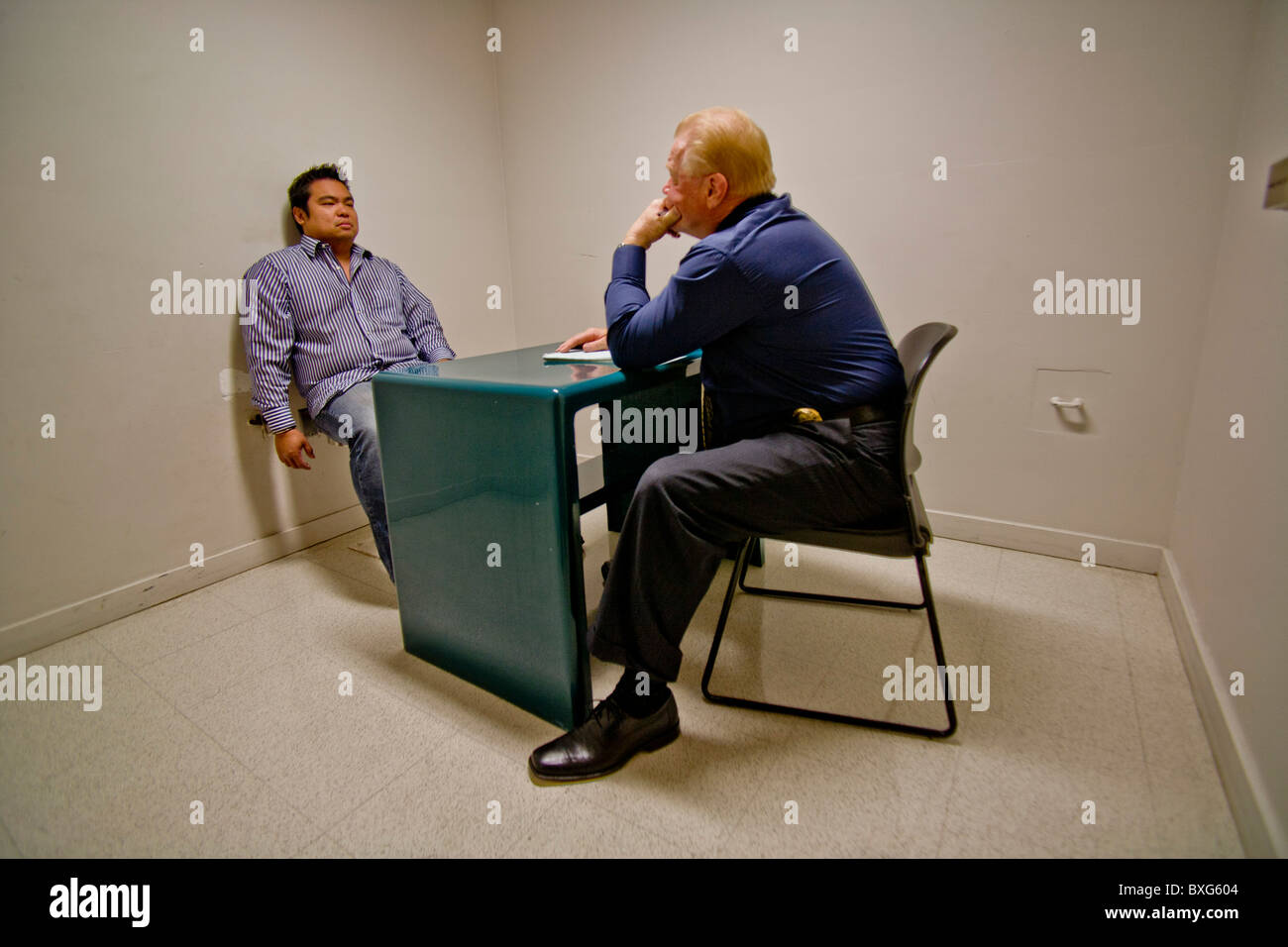 Handcuffed suspect interrogation room hi-res stock photography and ...