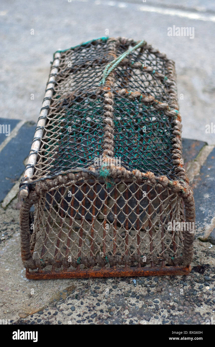 Creel Shaped Lobster pots arranged at the quay side awaiting the next ...