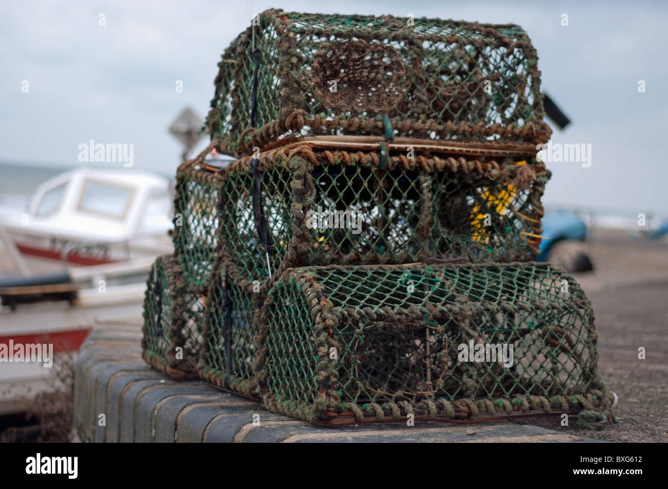 Creel Shaped Lobster pots arranged at the quay side awaiting the next ...