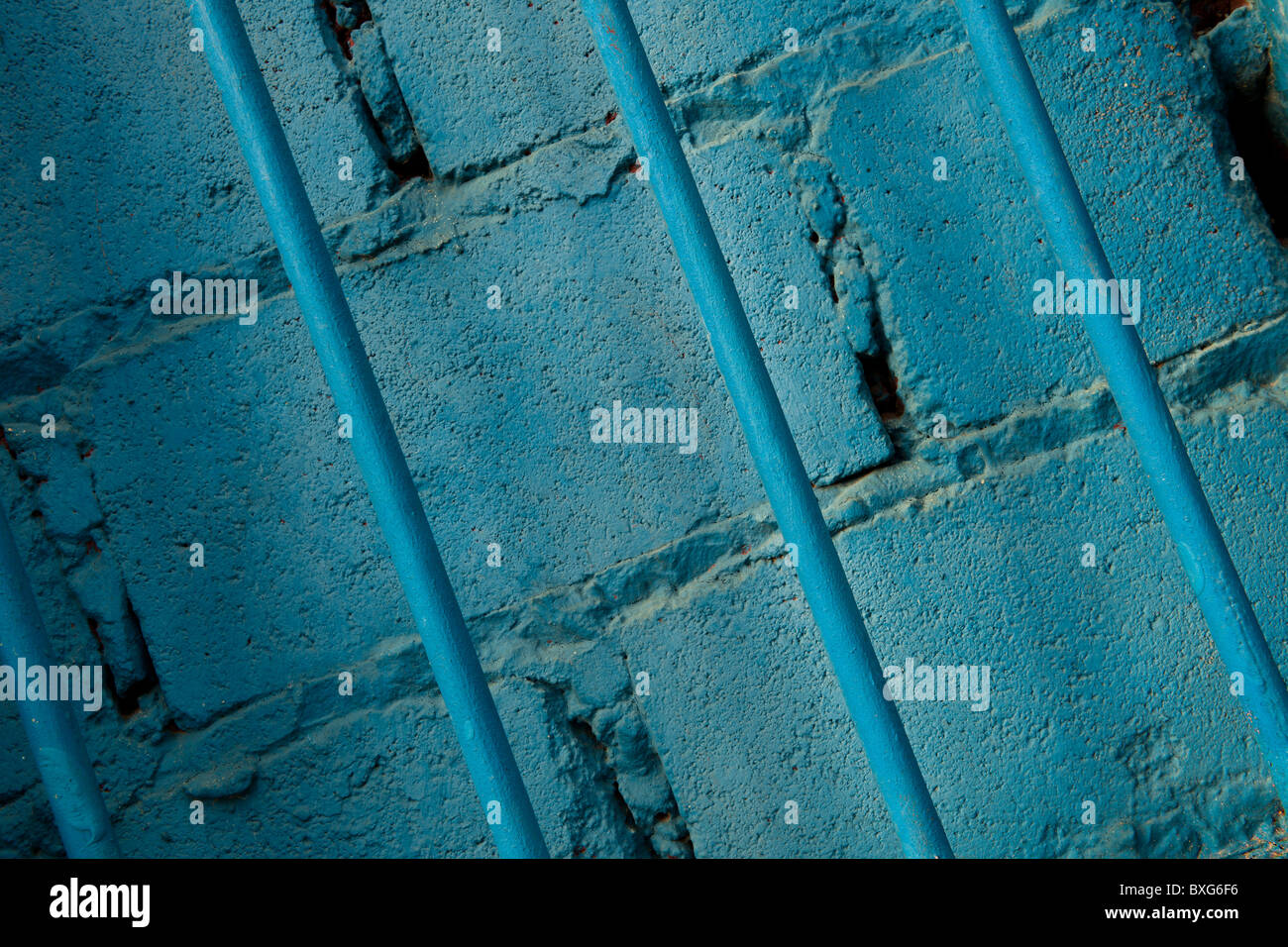 Blue wall with steel bars Stock Photo - Alamy