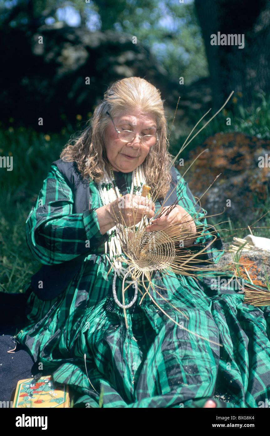 Kashia Pomo woman weaving 'cone shape acorn gathering basket' Stock ...