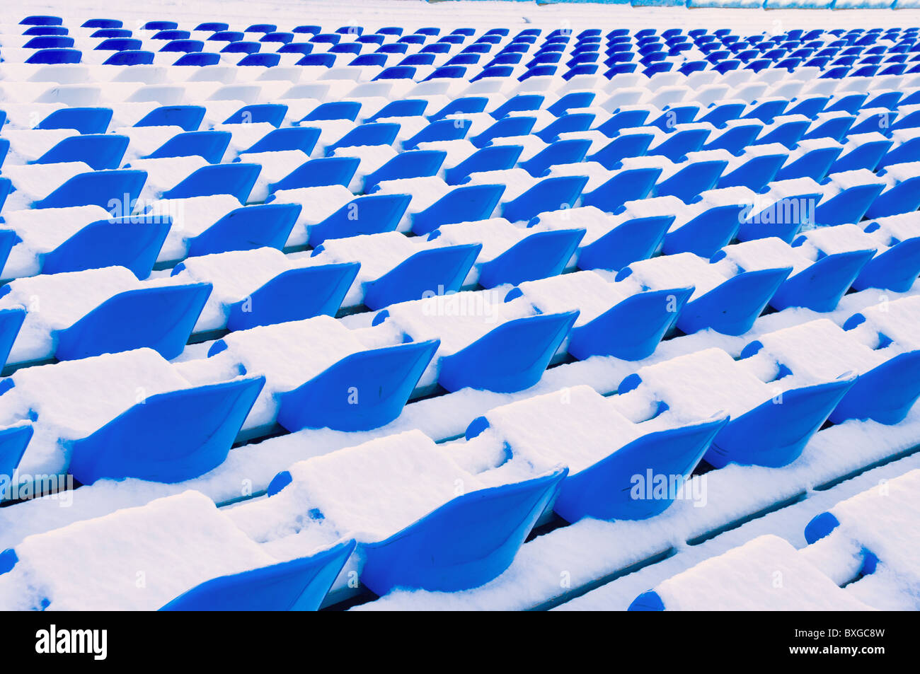 Blue benches at stadium in the winter under a snow layer Stock Photo ...