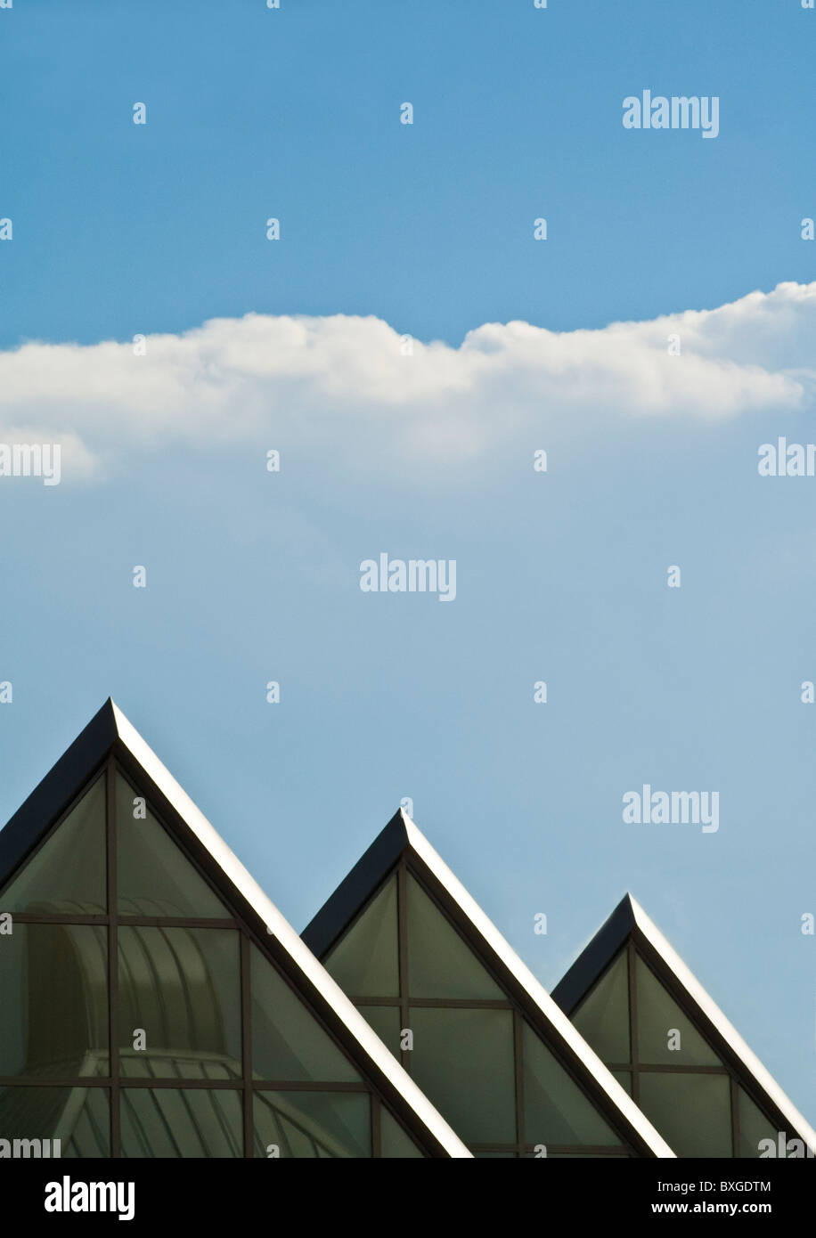 Building skylights form an abstract sequence against a blue sky Stock ...