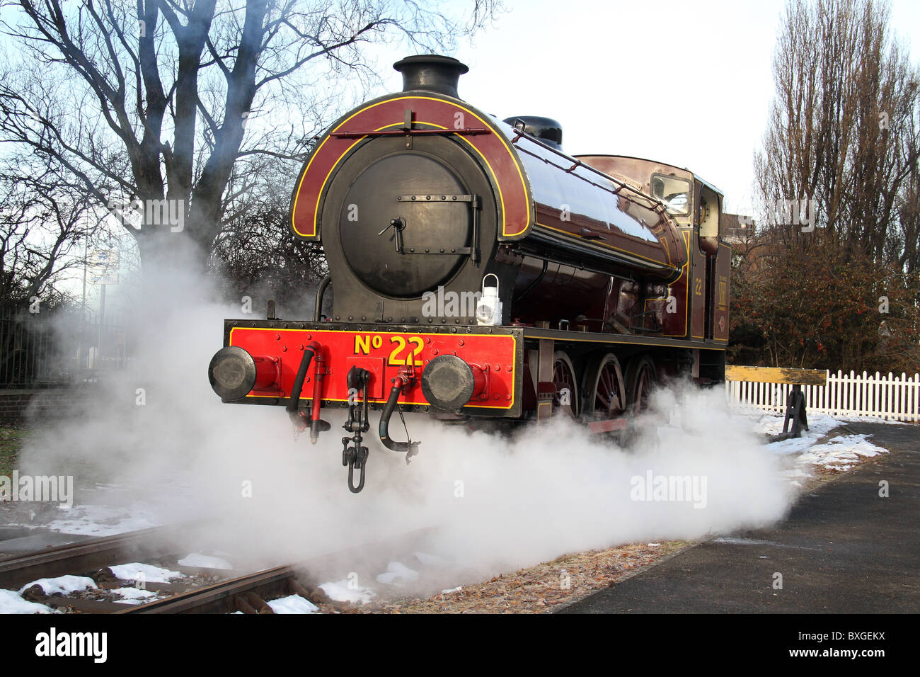 Steam saddle tanker railway engine in cold weather. Hunslett Austerity ...