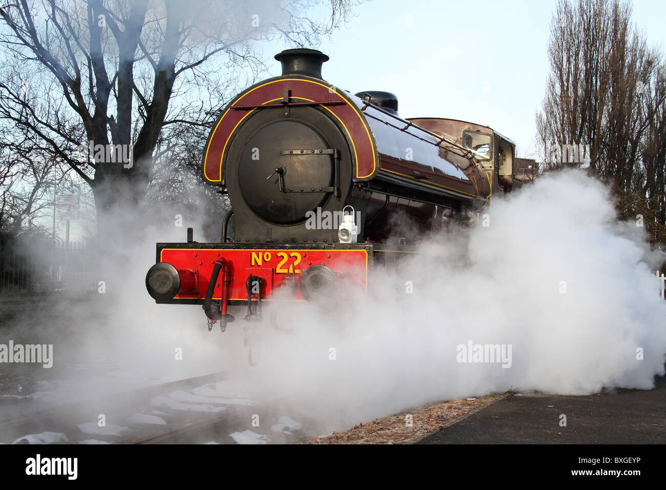 Steam saddle tanker railway engine in cold weather. Hunslett Austerity ...