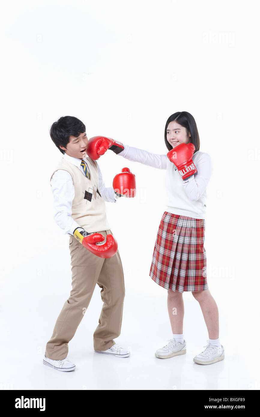 a girl hit the boy's jaw Stock Photo - Alamy