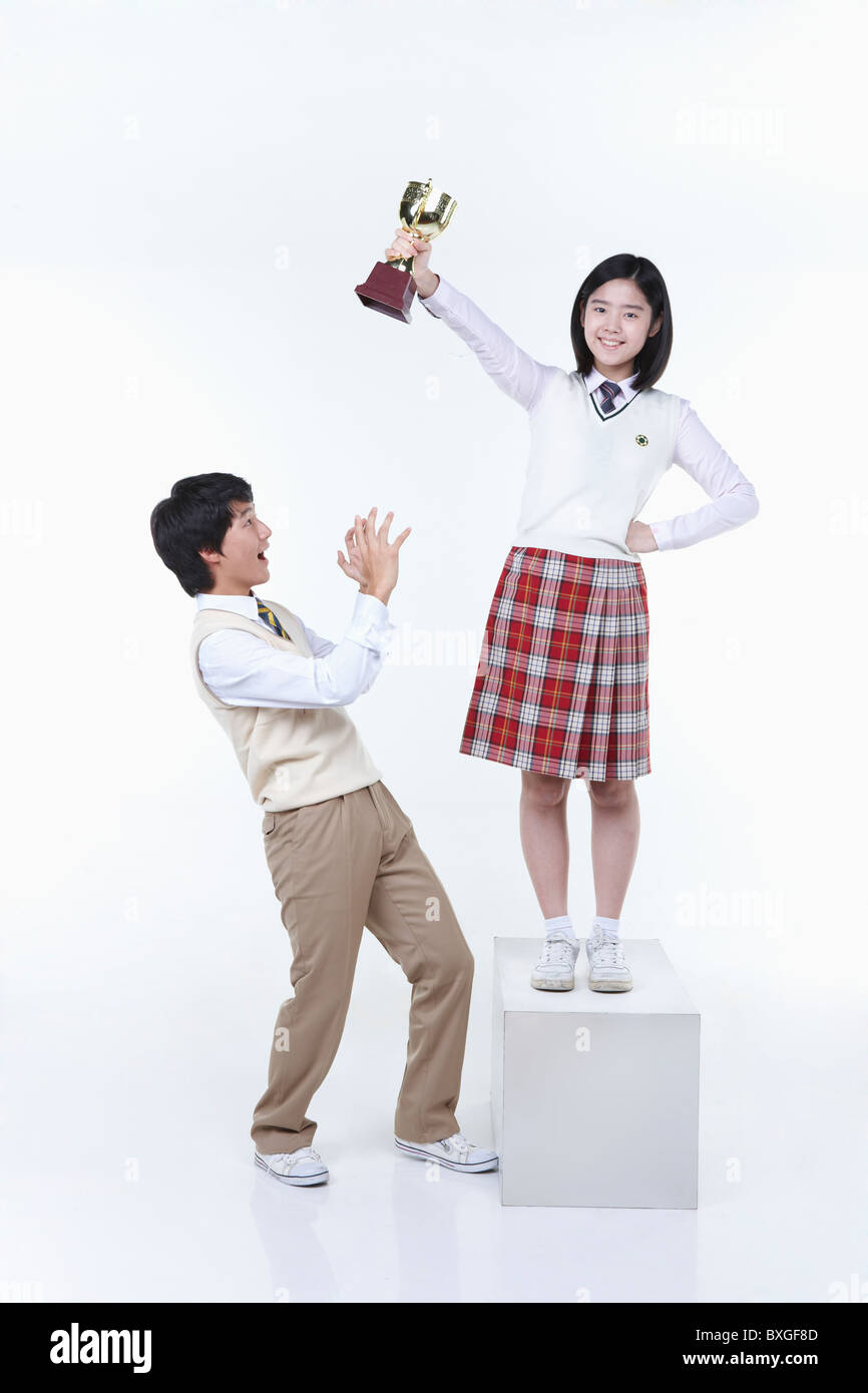 girl get the winner's trophy Stock Photo - Alamy