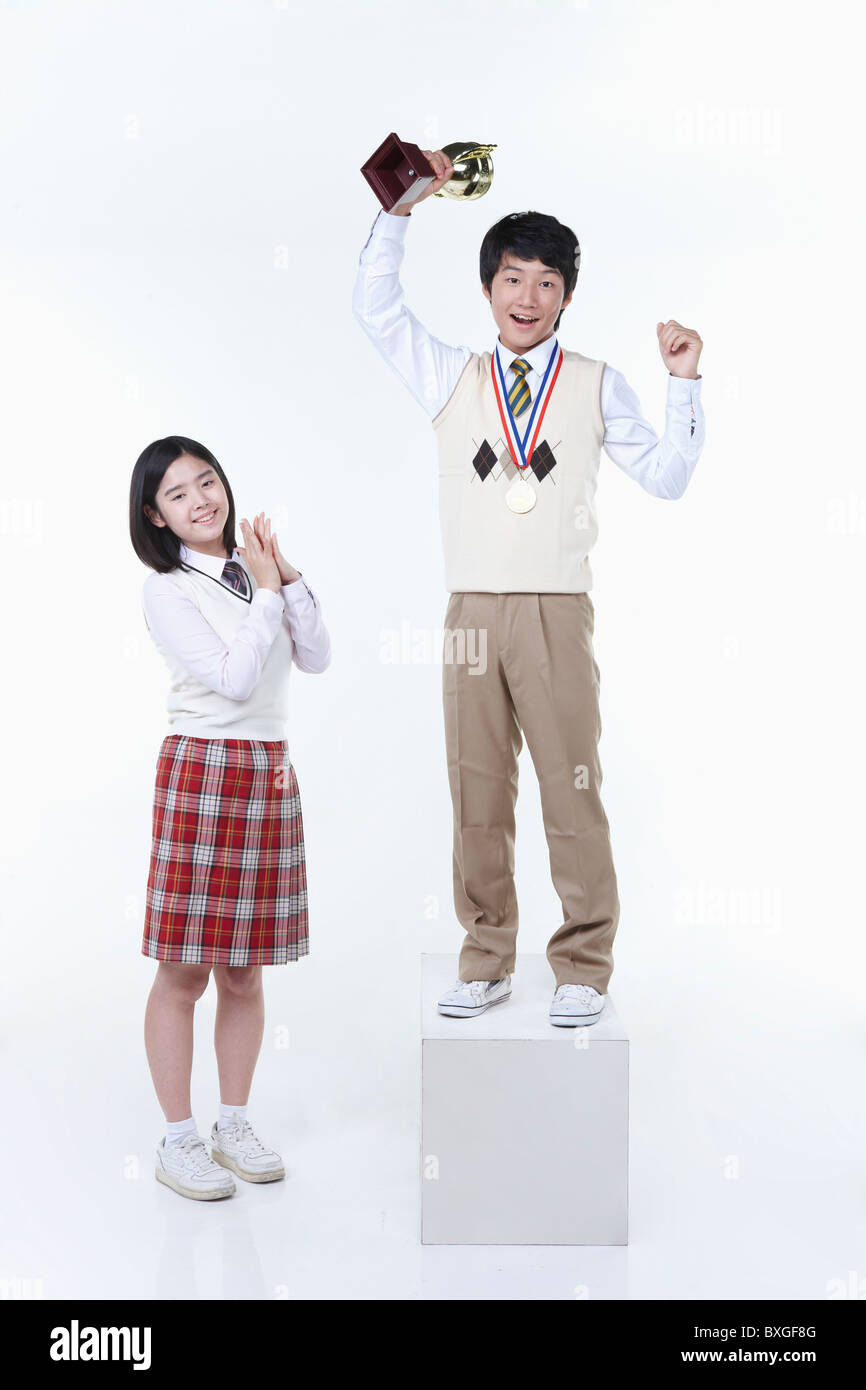 boy get the winner's trophy Stock Photo - Alamy