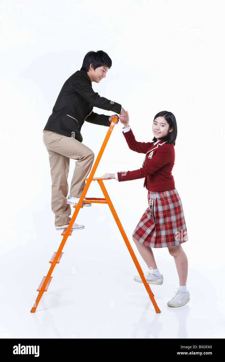 students going up ladder Stock Photo - Alamy