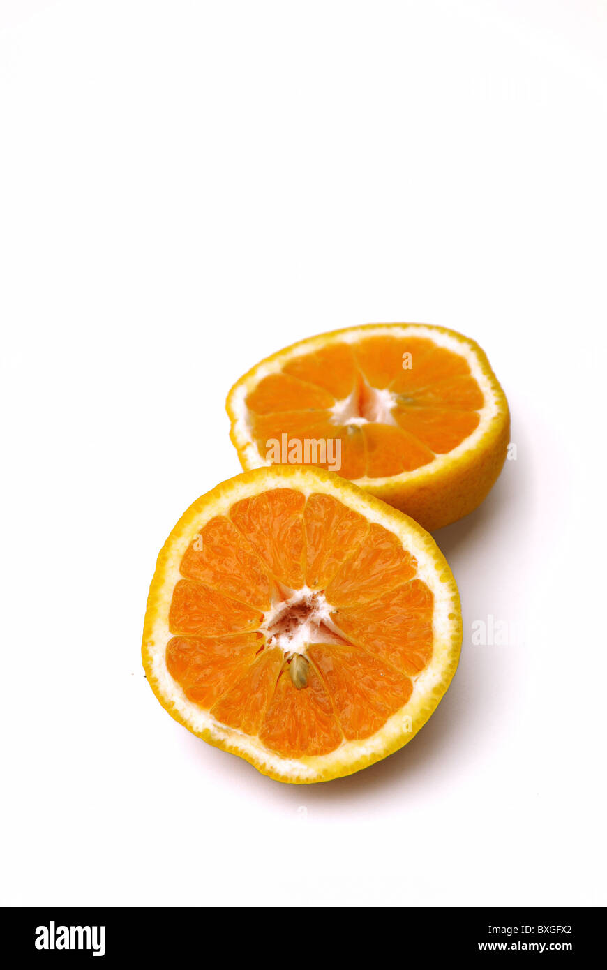 Orange fruit cut in half isolated on white background Stock Photo - Alamy