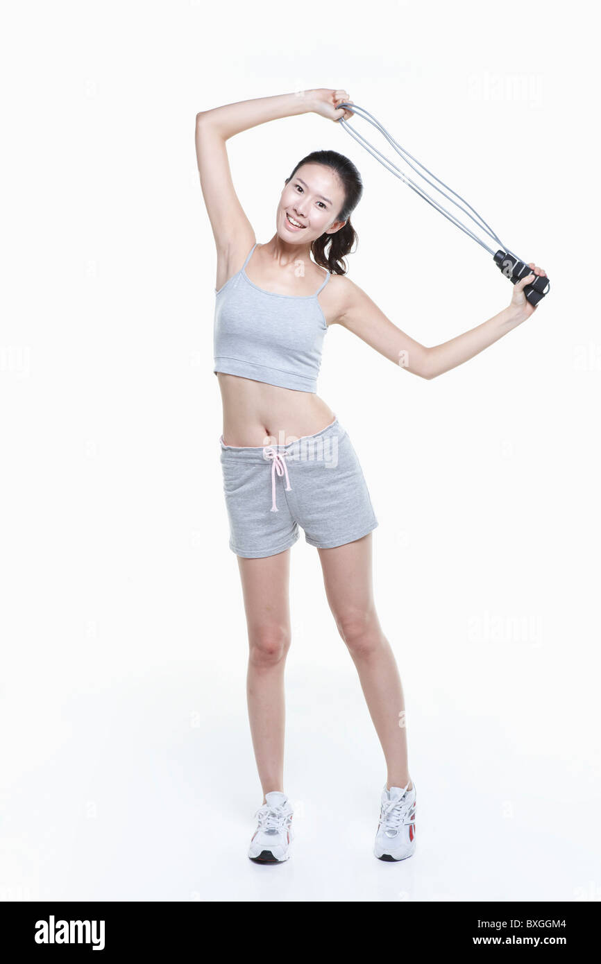 woman is stretching with rope Stock Photo - Alamy