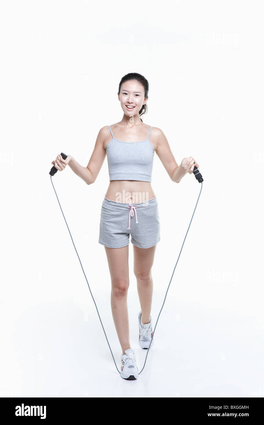 woman is stretching with rope Stock Photo - Alamy