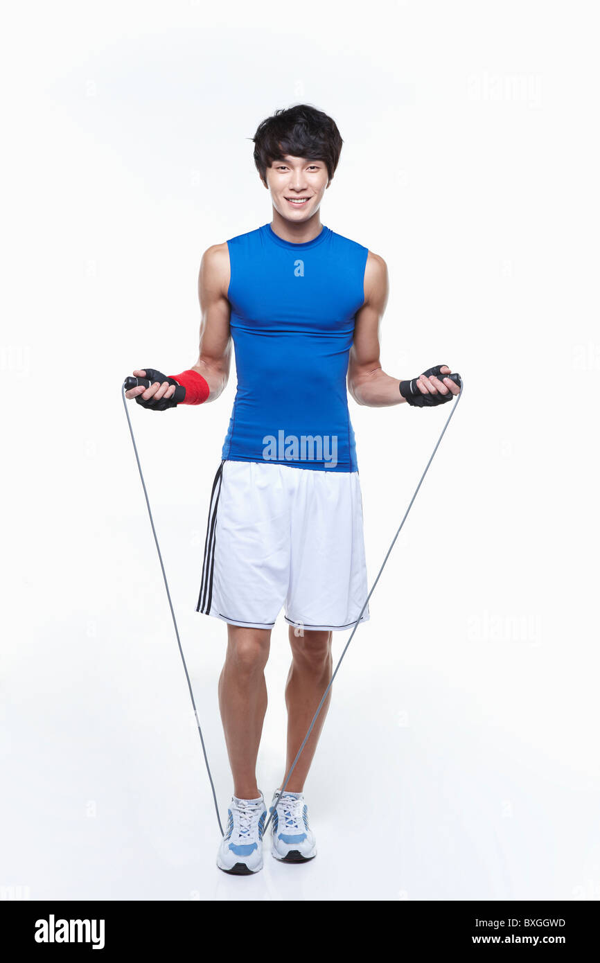 guy stretching with rope Stock Photo - Alamy