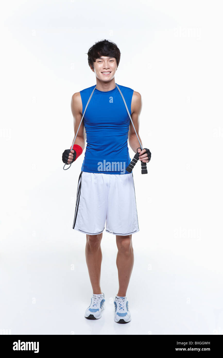 guy stretching with rope Stock Photo - Alamy