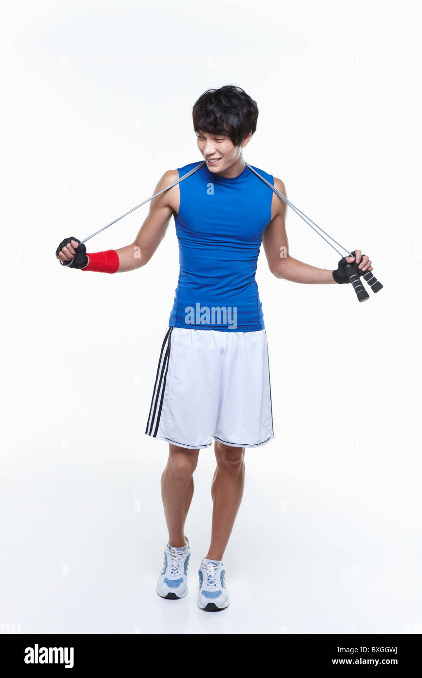 guy stretching with rope Stock Photo - Alamy