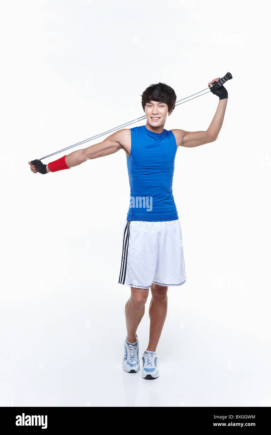 guy stretching with rope Stock Photo - Alamy