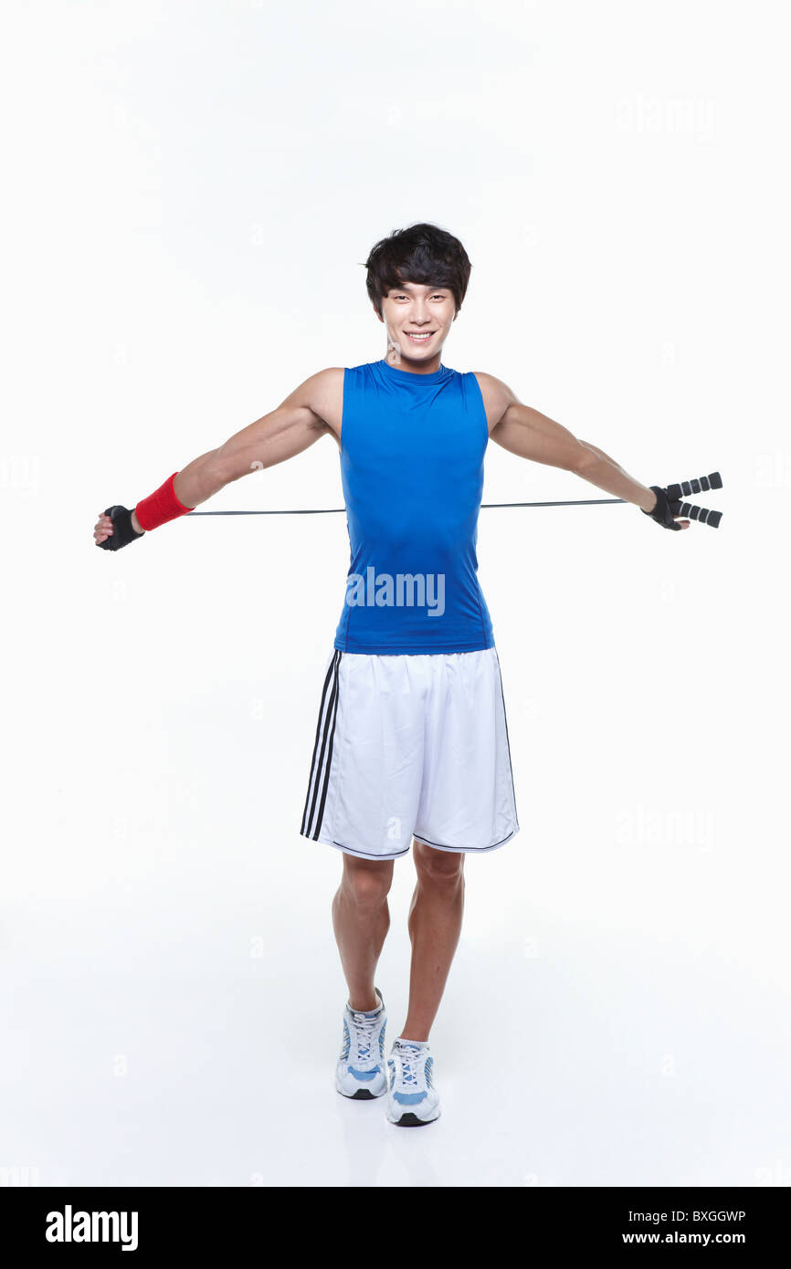 guy stretching with rope Stock Photo - Alamy