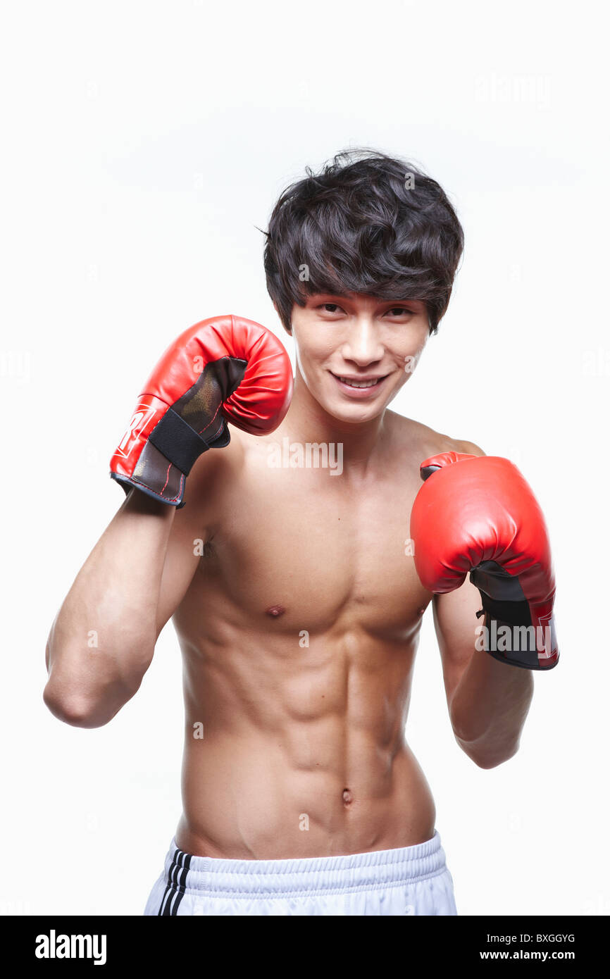 guy wearing boxing gloves Stock Photo - Alamy