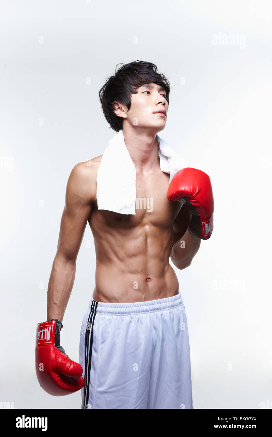 guy wearing boxing gloves Stock Photo - Alamy