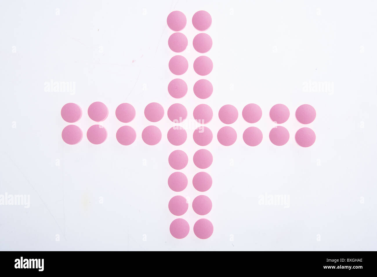pills in crossed shape Stock Photo - Alamy