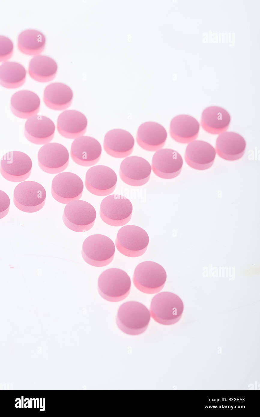 pills in crossed shape Stock Photo - Alamy