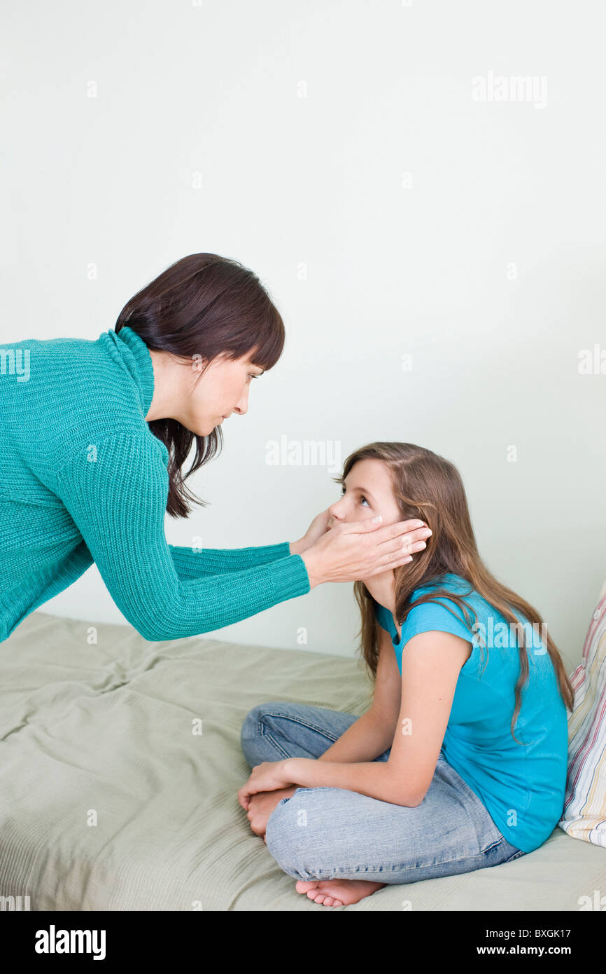 Mother taking care of sick daughter Stock Photo - Alamy