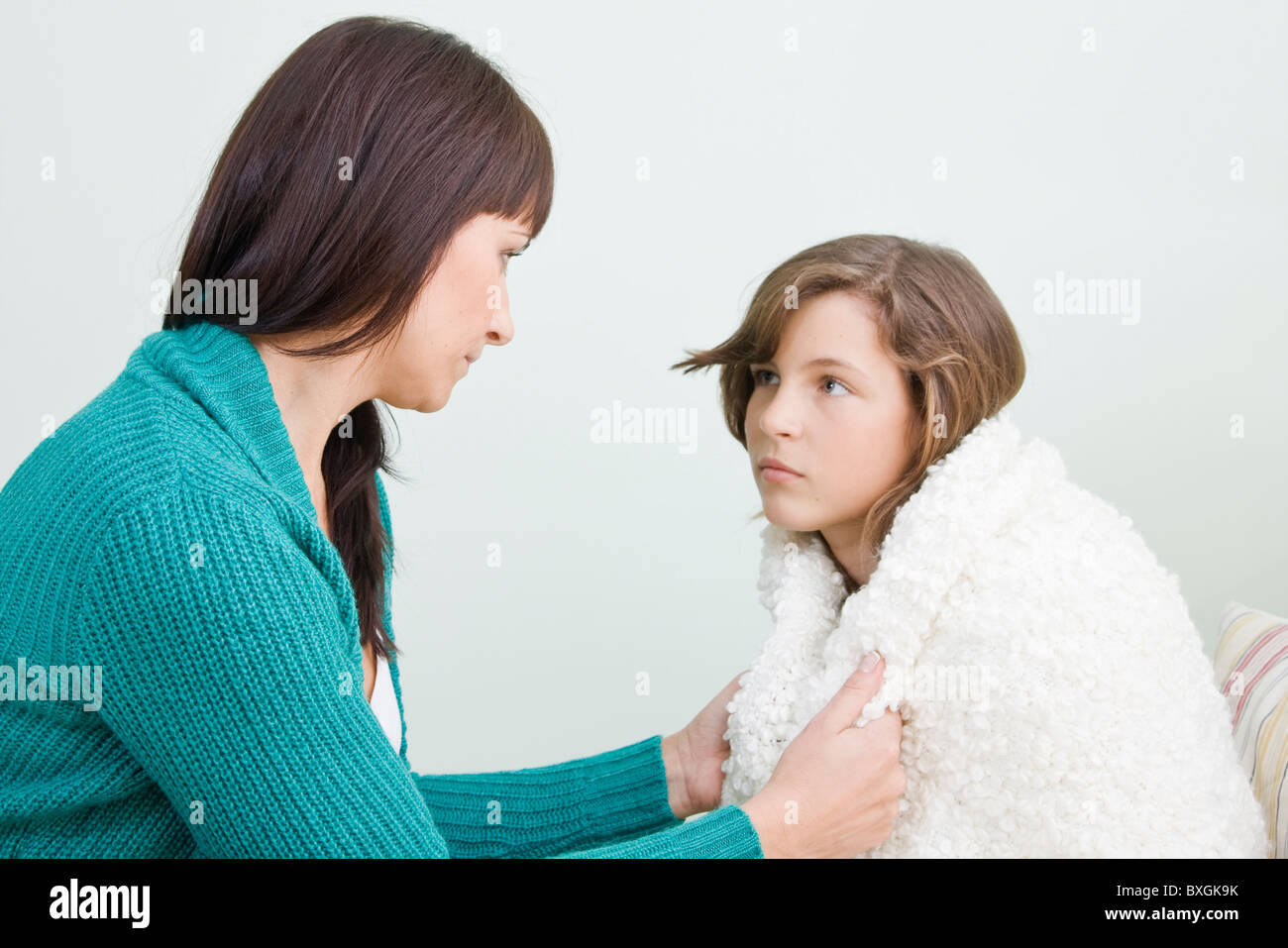 Mother taking care of sick daughter Stock Photo - Alamy