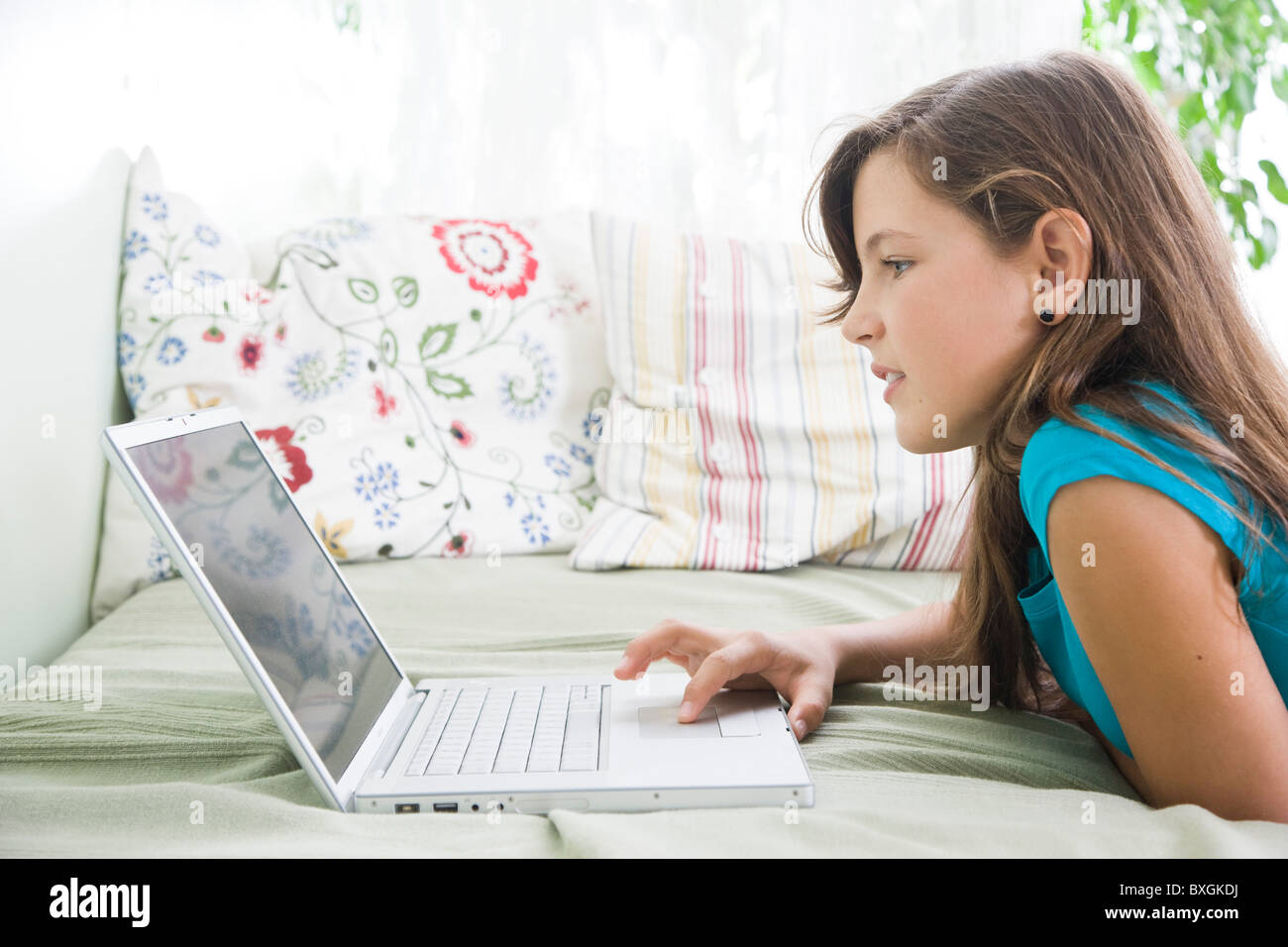 Teenaged girl with computer Stock Photo - Alamy