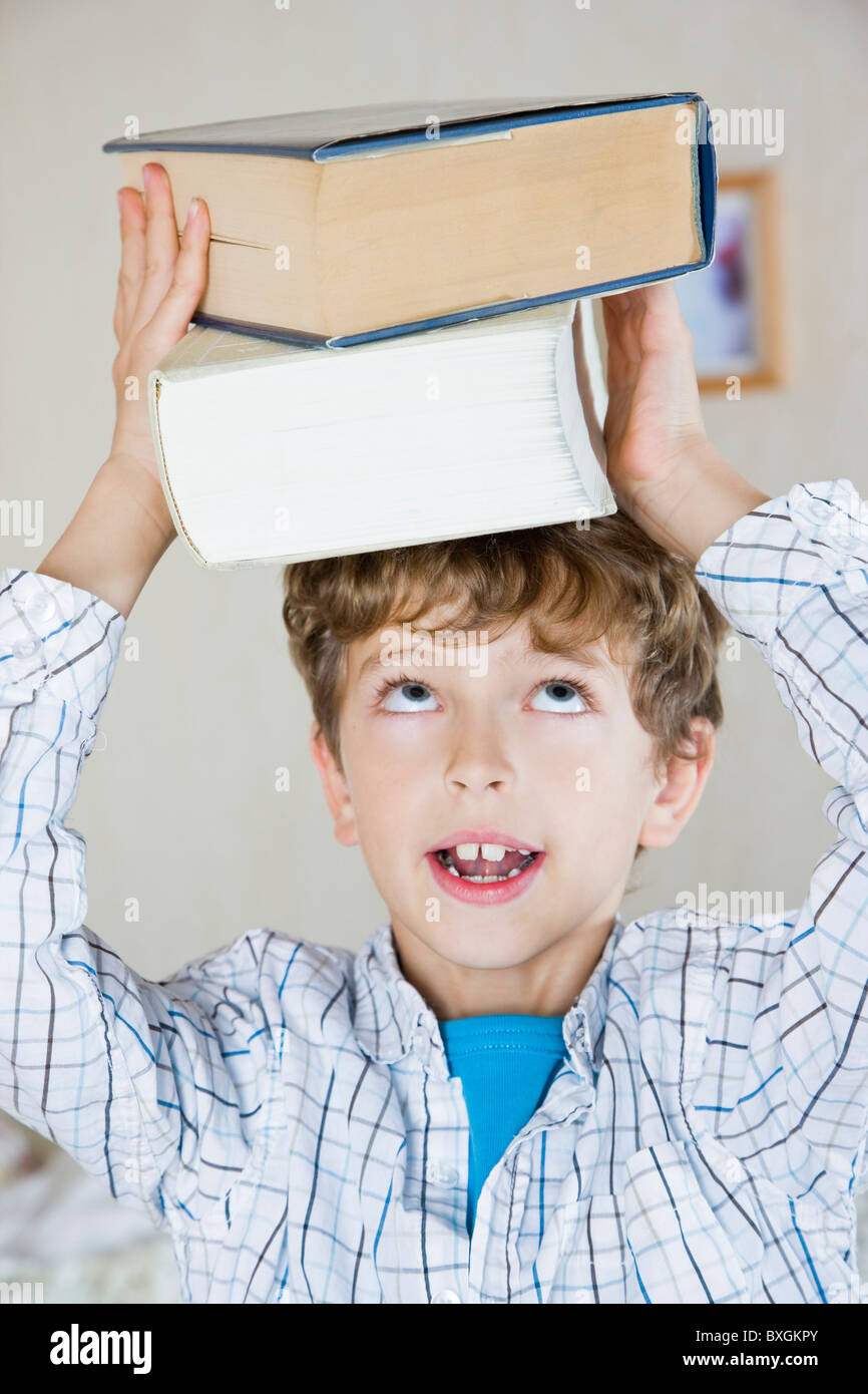 Boy with books Stock Photo - Alamy