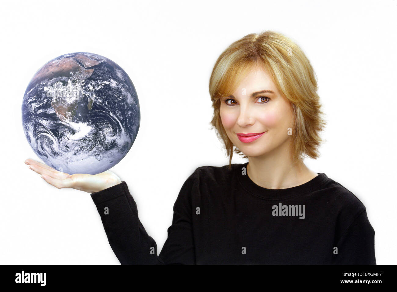 Close-up of a lovely young sandy-blonde woman holding the earth in her ...