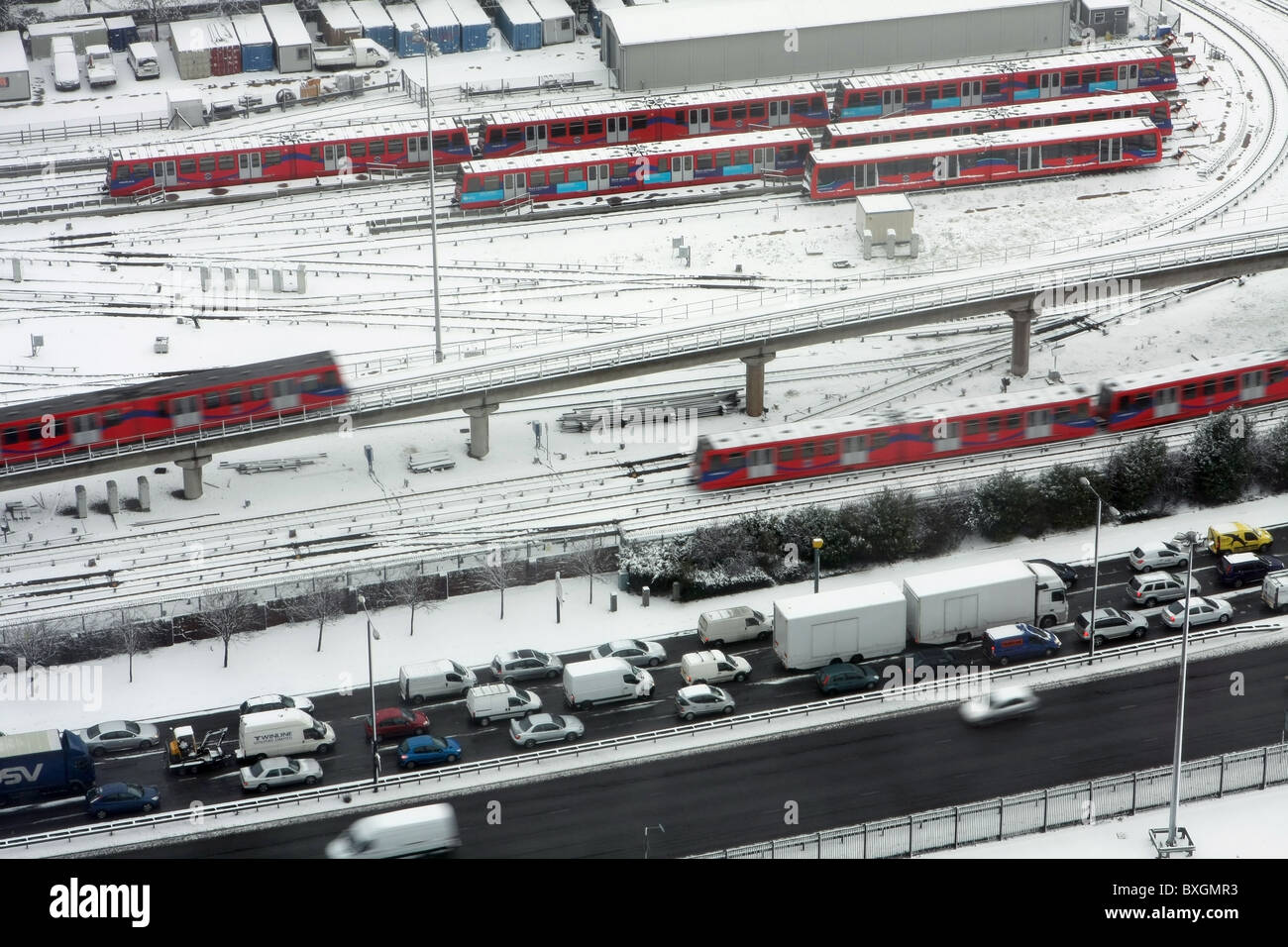 A snowy scene at Poplar, East London, with DLR trains in sidings and ...