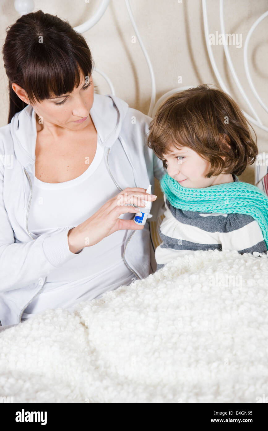 Mother taking care of sick daughter Stock Photo - Alamy
