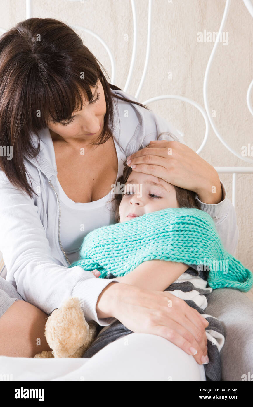 Mother taking care of sick daughter Stock Photo - Alamy