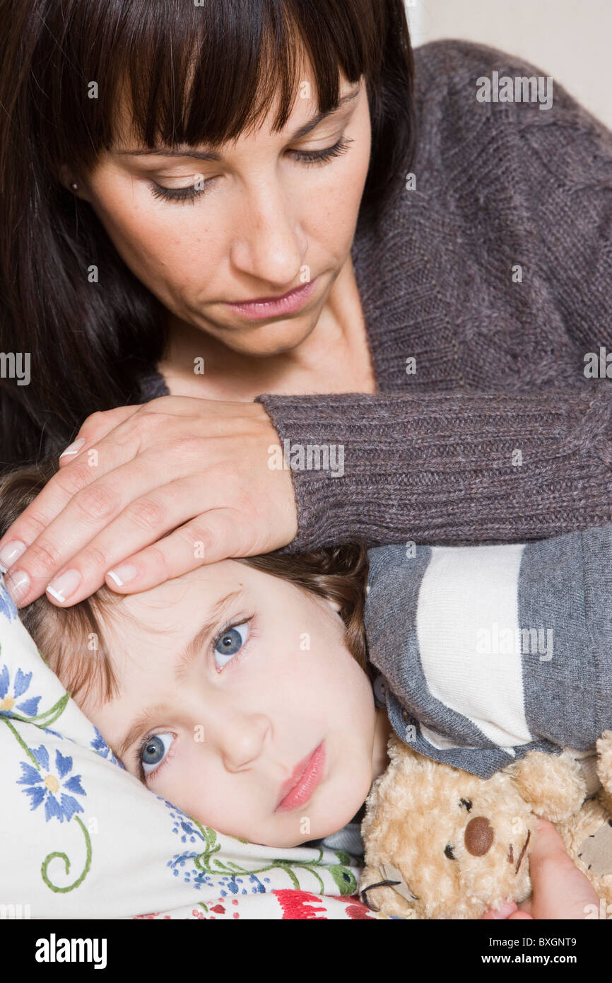 Mother taking care of sick daughter Stock Photo - Alamy