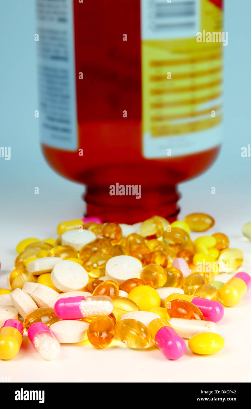 A stack of different coloorful tablets Stock Photo - Alamy