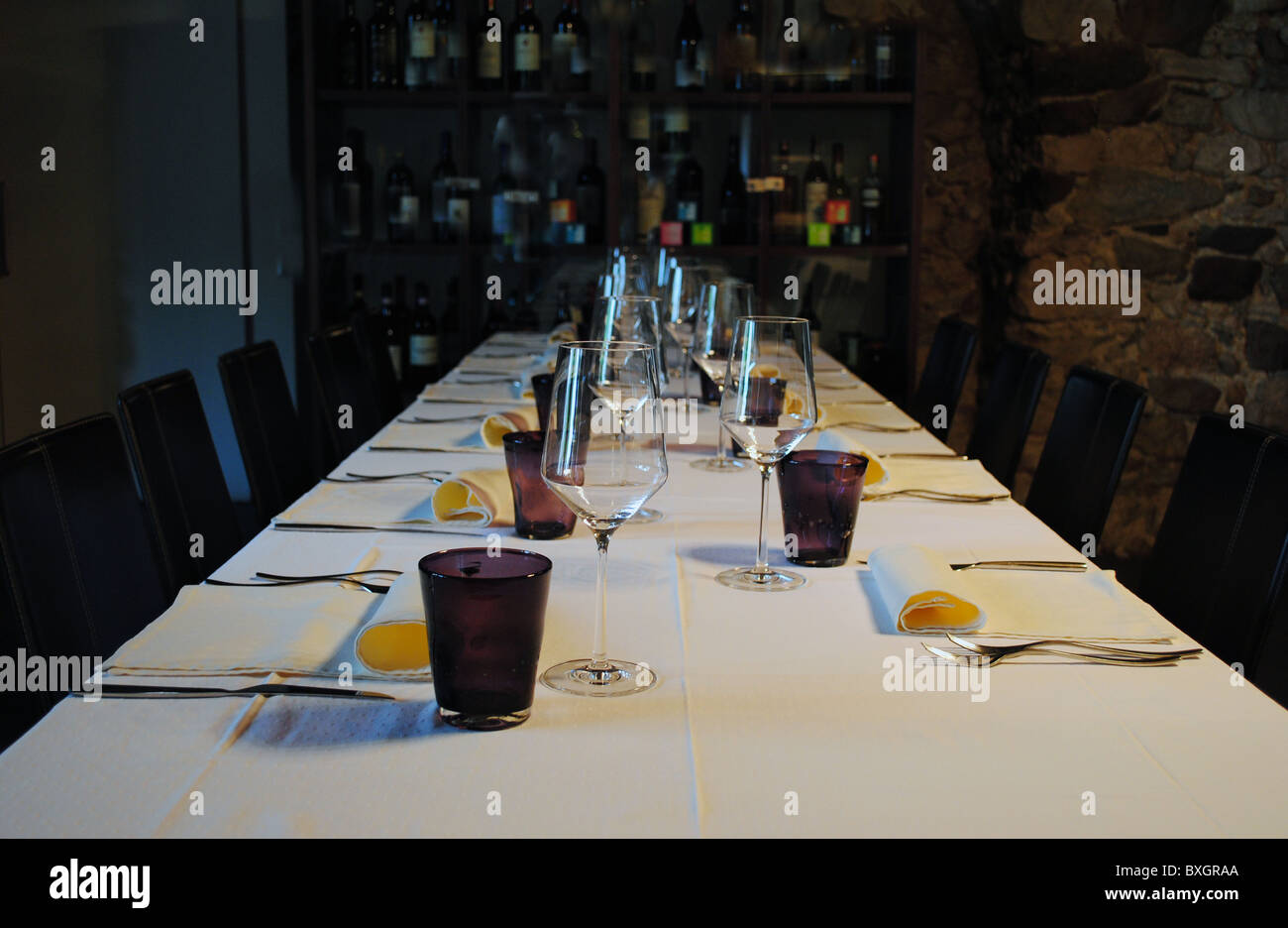 restaurant table set with wine and water glasses and cutlery Stock ...
