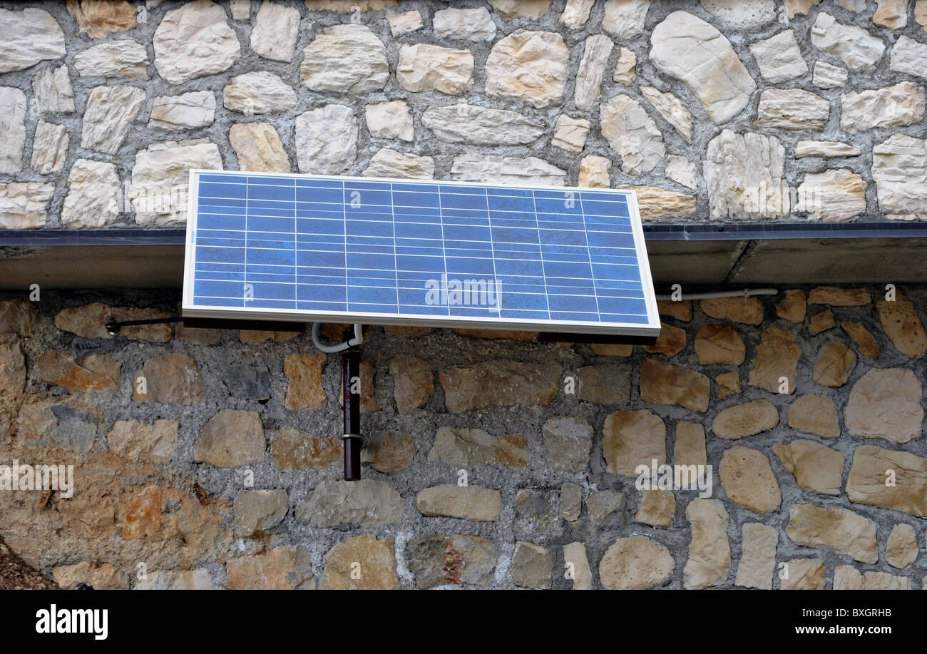 solar panels to produce electricity from sunlight through Stock Photo ...