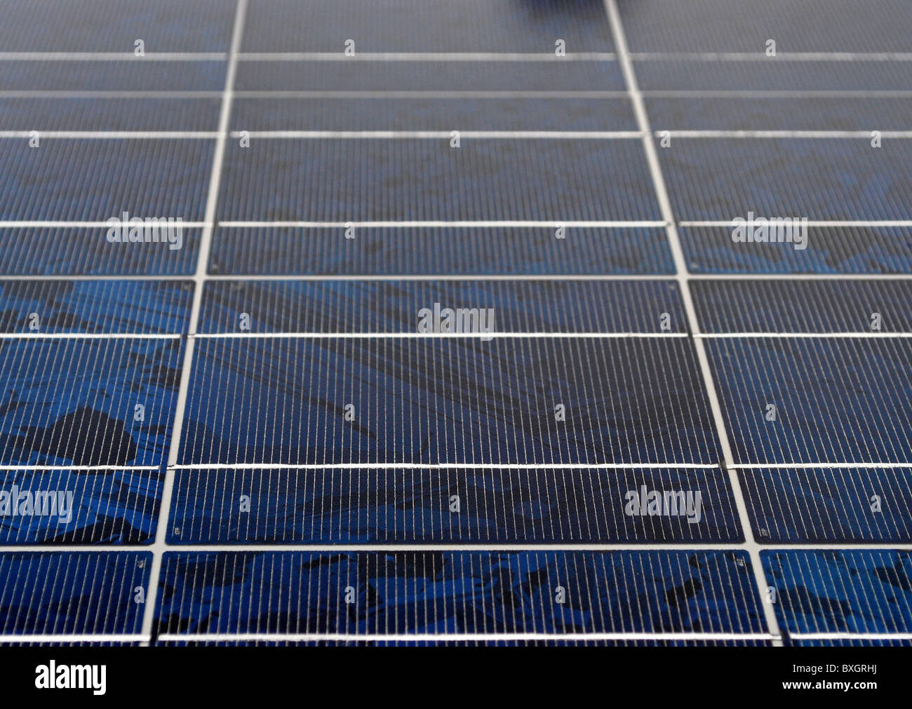 solar panels to produce electricity from sunlight through Stock Photo ...