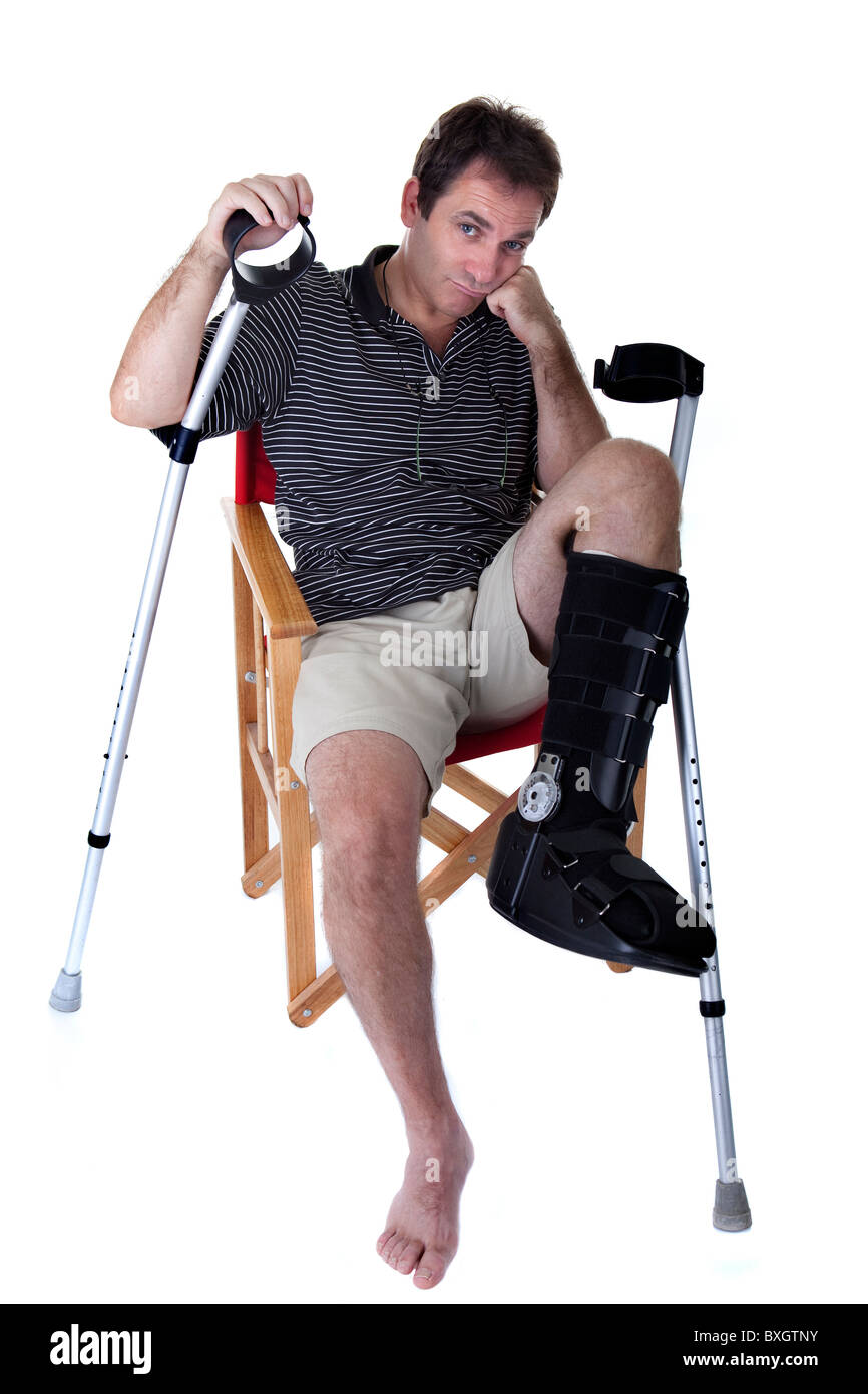 Mature man with broken legs, with crutches, and showing a boring ...