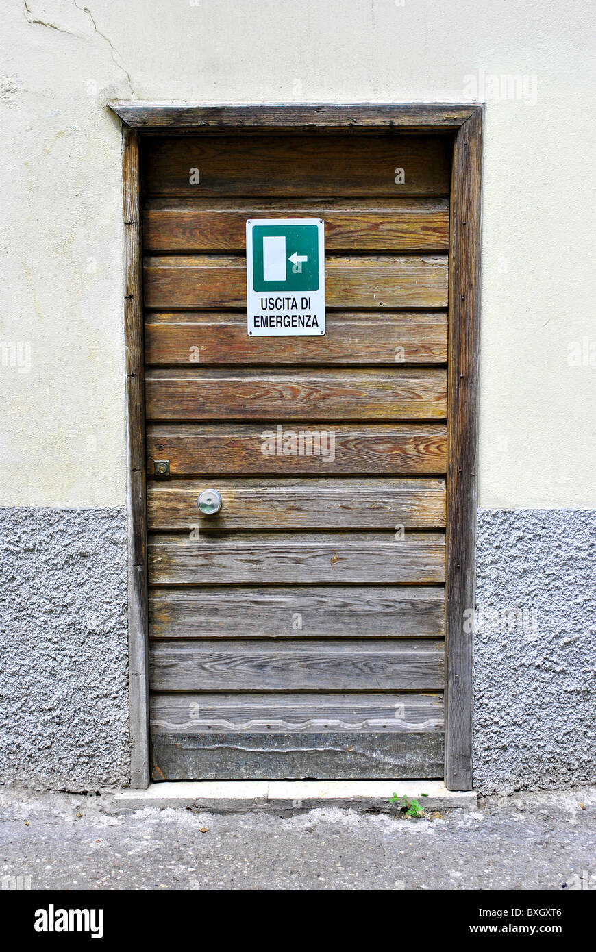 door wooden table with green emergency exit visual signal Stock Photo ...