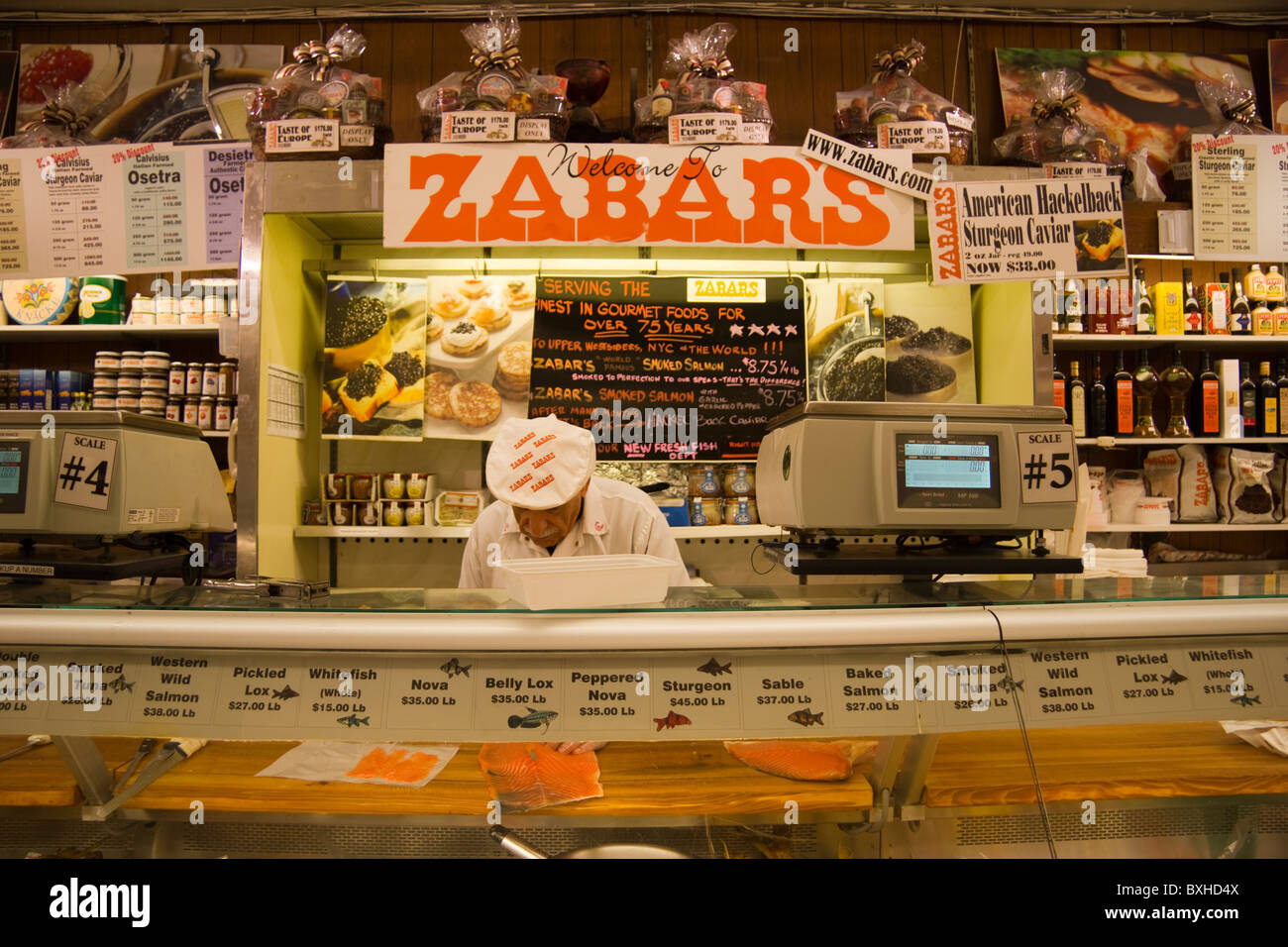 Salesman at the fish counter at Zabar's West Side Delicatessen New York ...