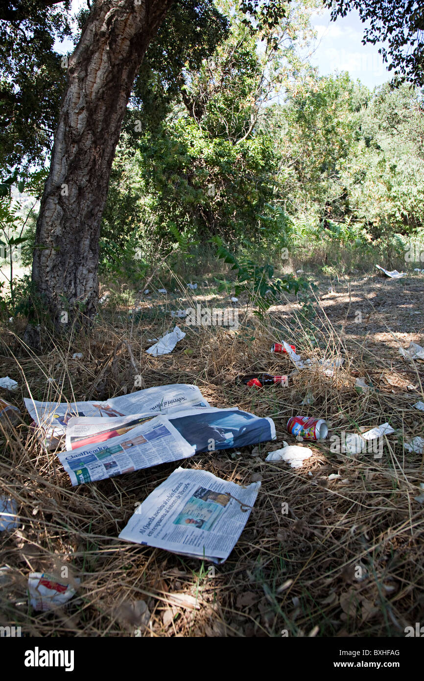 Litter in picnic site under trees near Roses Emporda Catalunya Spain ...