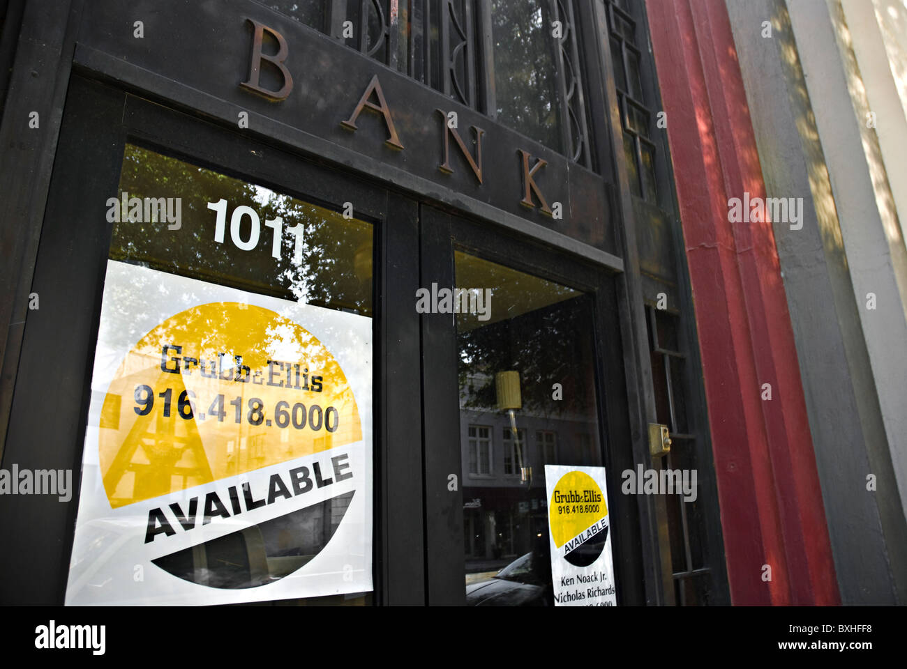 Grubb and Ellis for sale signs in a bank doorway Stock Photo - Alamy