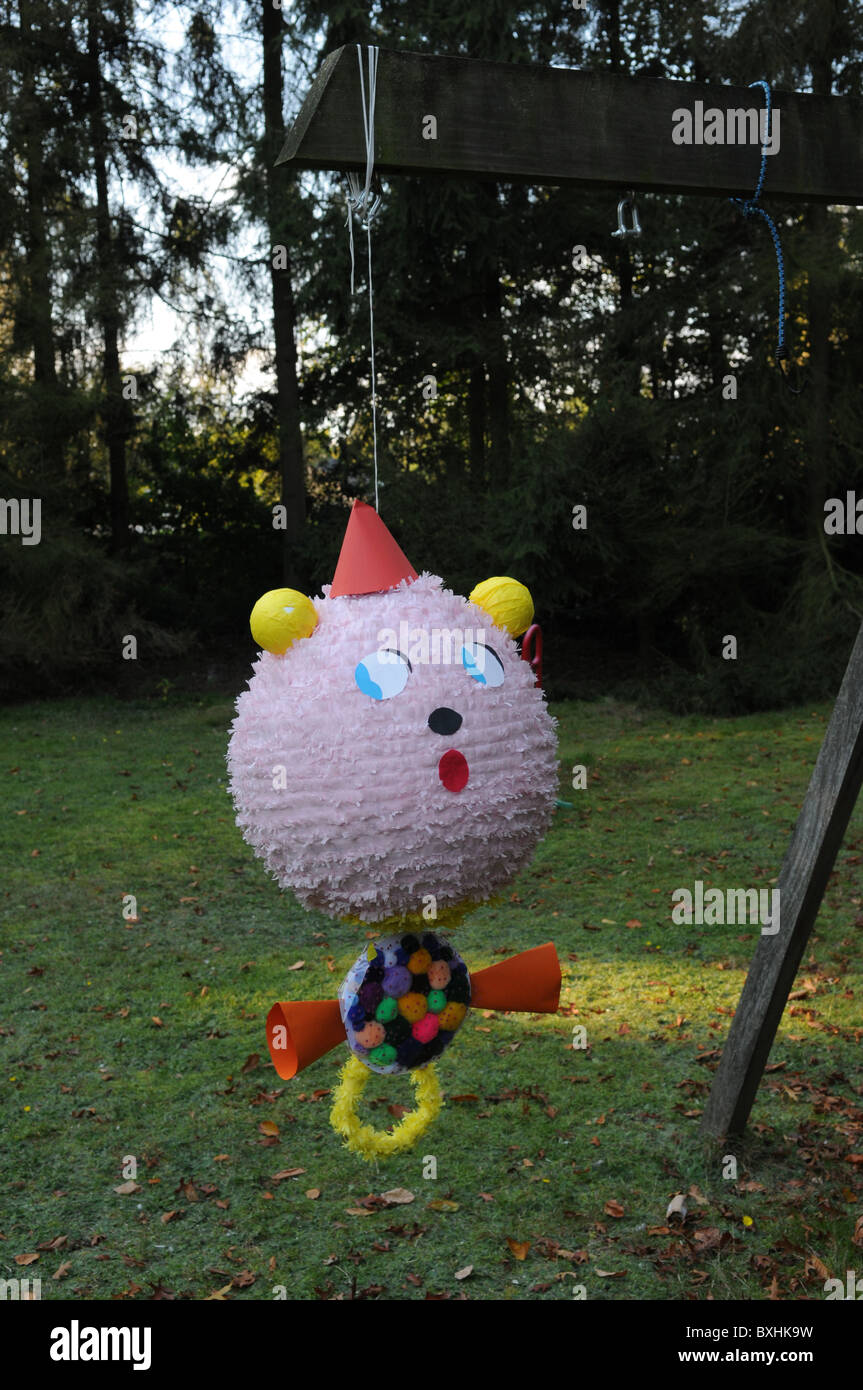 pink pinata, birthday party, pinata with pink face, pinata in garden ...