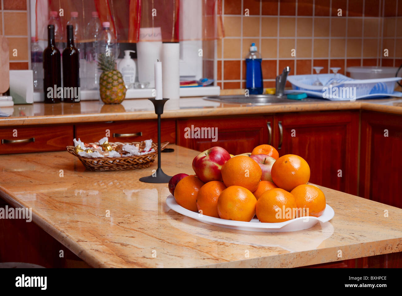 Kitchen interior with fruits on the table Stock Photo - Alamy