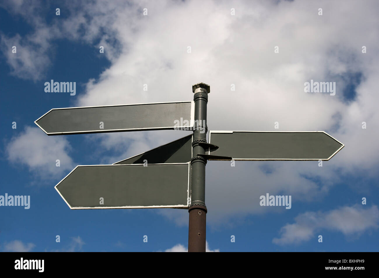 Blank signpost showing different directions Stock Photo - Alamy