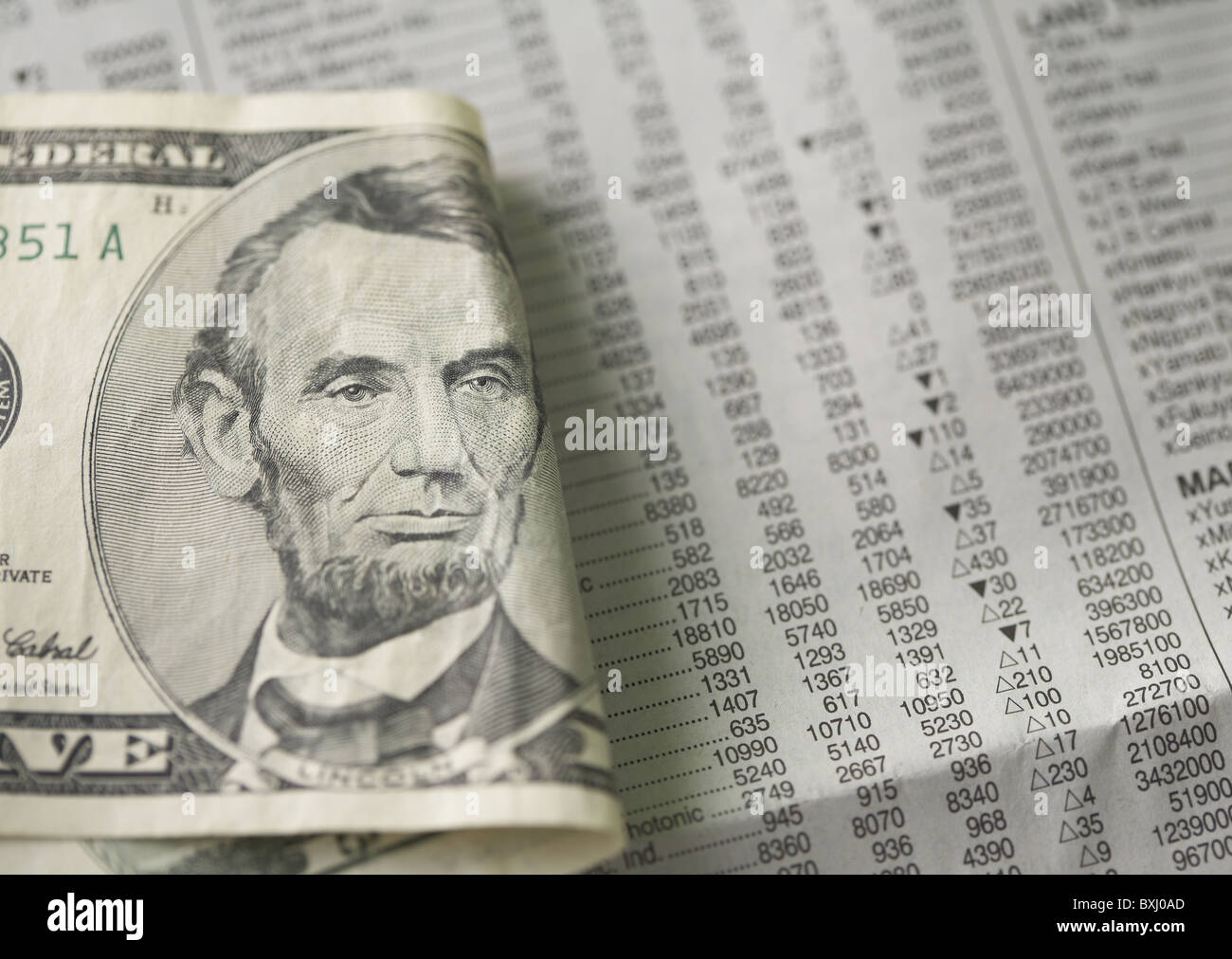 Dollar bill and newspaper Stock Photo - Alamy