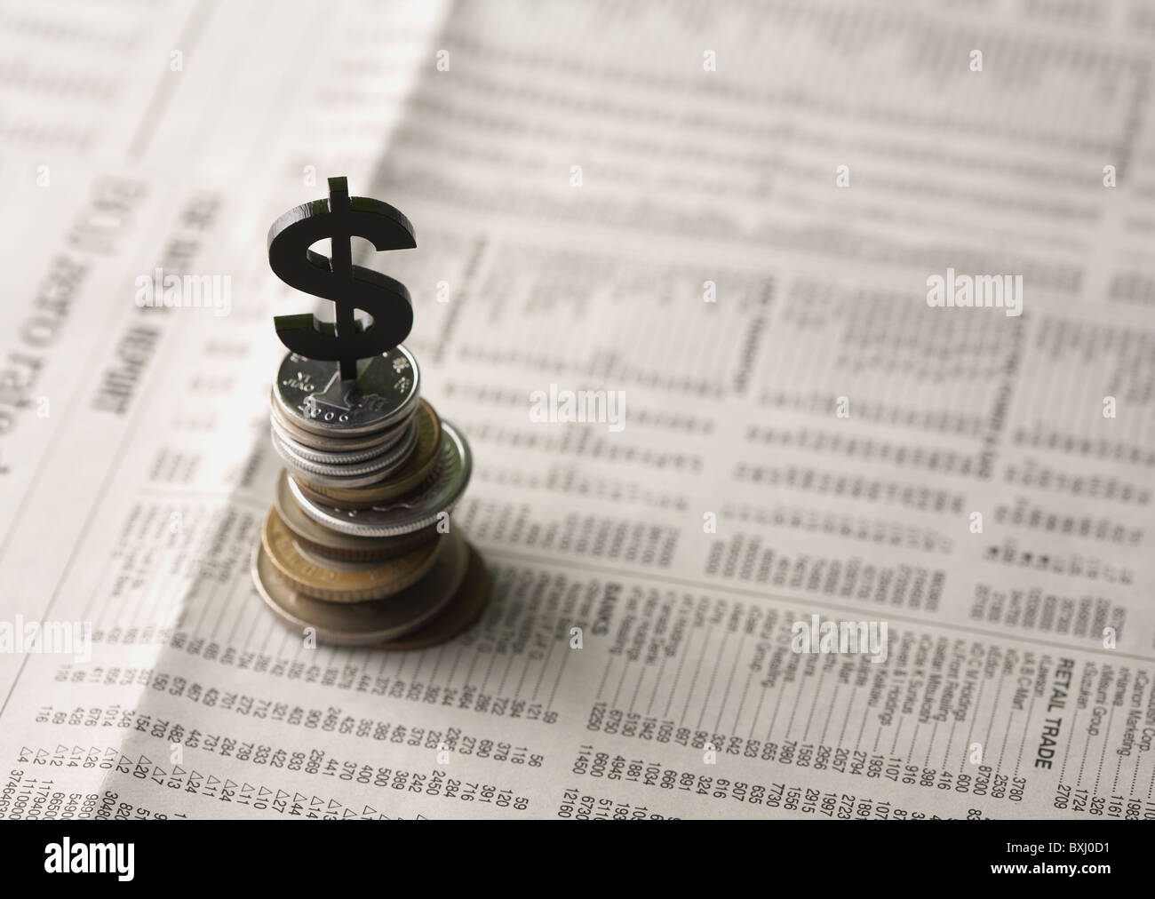 Dollar sign and coins Stock Photo - Alamy