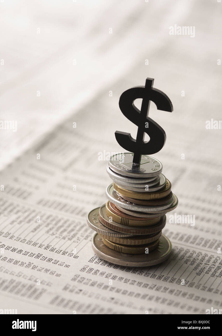 Dollar sign and coins Stock Photo - Alamy